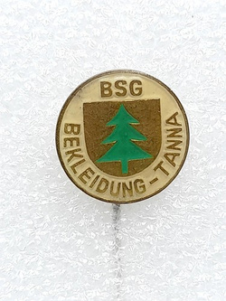 BSG Bekleidung-Tanna badge (East Germany, epoxy) | Badges \ Germany